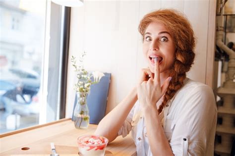 Free Photo Beautiful Young Woman Enjoying Her Dessert
