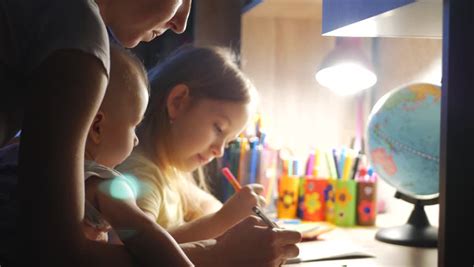 Young Mother Helps Her Daughter Homework Stock Footage Video 100