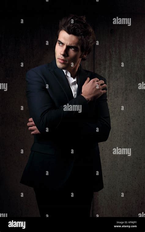 Charismatic Handsome Male Model Posing In Blue Fashion Suit And White