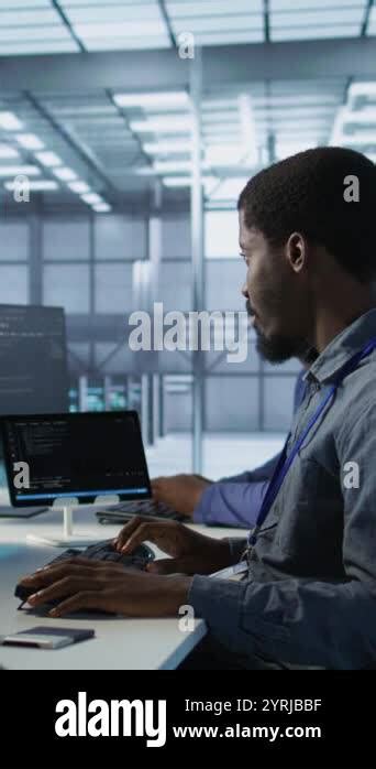 Vertical Video Cheerful Coworkers In Data Center Implementing Ai