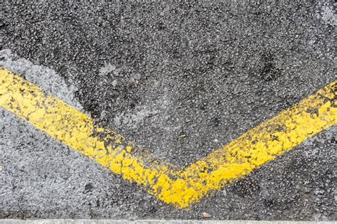 Premium Photo Close Up Of Yellow Puddle On Road