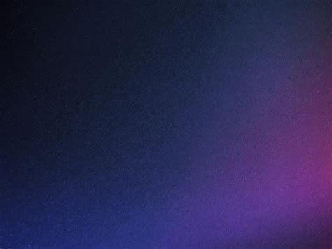 A Purple And Pink Light Is Shining On A Dark Background Premium Ai