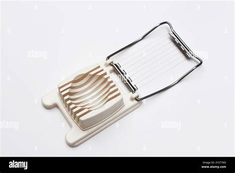 Egg Slicer Kitchen Utensil On White Background Stock Photo Alamy