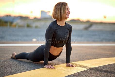Amazing Fit Strong Young Caucasian Woman Outdoors Make Yoga Stretching