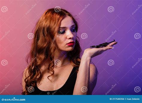 Beautiful Seductive Fashion Redhead Female With Make Up With A Scorpion