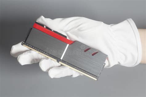 Hand In White Glove Holding High Performance DDR4 Computer Memor Stock