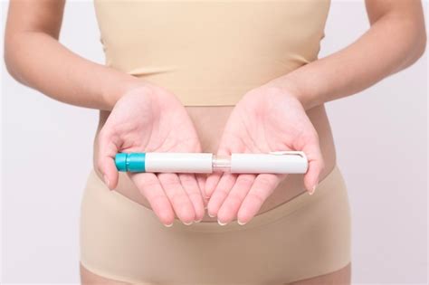 Premium Photo Close Up Woman Using Ivf Treatment Injection On Belly To Prepare Reproductive