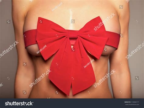 Naked Female Having Her Breasts Wrapped Shutterstock