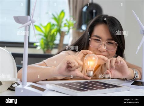 A Young Woman Experimenting With Using Renewable Energy From Sunlight