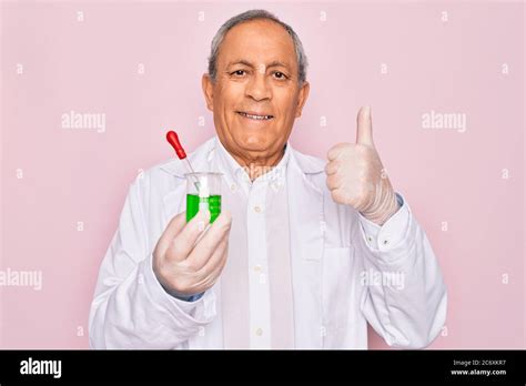 Senior Grey Haired Scientist Man Wearing Holding Sample Tube Test Over