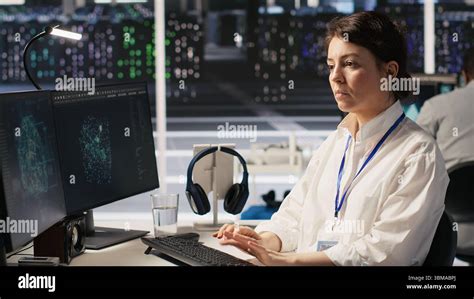 Data Center Technician Monitors Server Rigs Performing Ai Training And