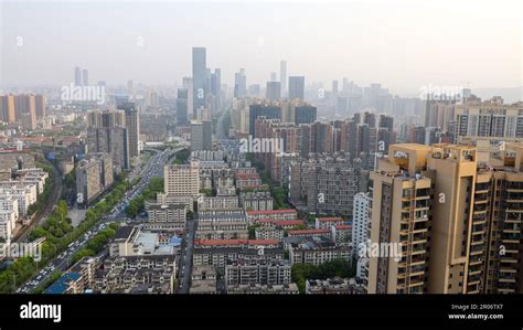 Time Lapse Of Modern Complex And Traffic Along On Busy Road From