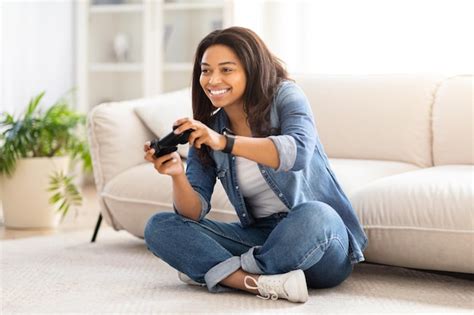 Premium Photo Woman Sitting On Floor Playing Video Game