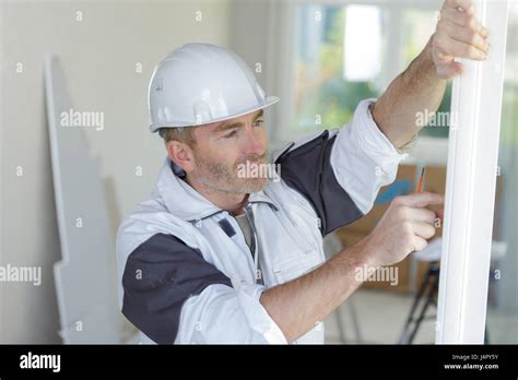 Man Fitting Window Frame Stock Photo Alamy