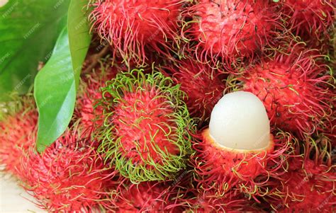 Premium Photo Ripe Rambutan Whole Fruits And Opened To Show