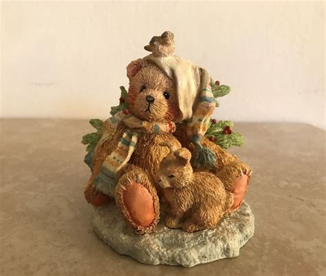 Two Teddy Bears Sitting On Top Of Each Other