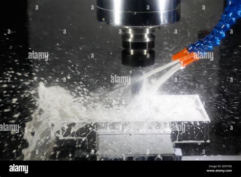 CNC Machining Center Milling With Cutting Coolant Stock Photo Alamy