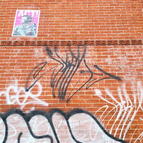 Graffiti On Brick Building