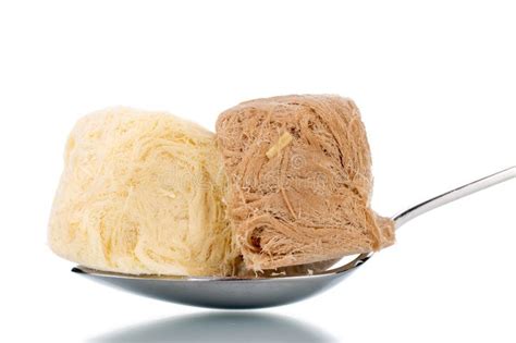 Several Pieces Of Sweet Stringy Halva With Ceramic Dishes Macro Isolated On White Background