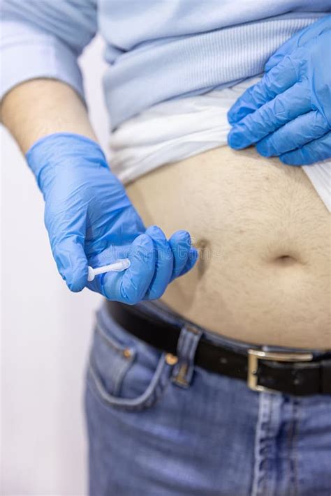 How To Properly Give Yourself Subcutaneous Injection In Your Stomach Concept Cropped Photo Of A