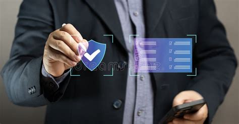 Businessman Using Pen On Virtual Screen With Shield Of Security Online Security Entering Code