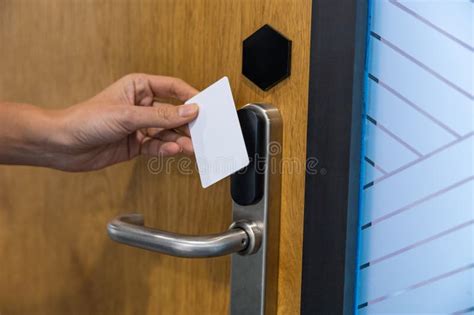 Unrecognizable Female Worker Holding Digital Access Card Scanning It On Electronic Reader At