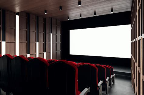 어둡고 세련된 방에 빨간 좌석과 큰 빈 스크린이 있는 현대적인 영화관 인테리어로 영화 상영 및 프레젠테이션을 위해 설계되었습니다 3d 렌더링 0명에 대한 스톡 사진 및 기타