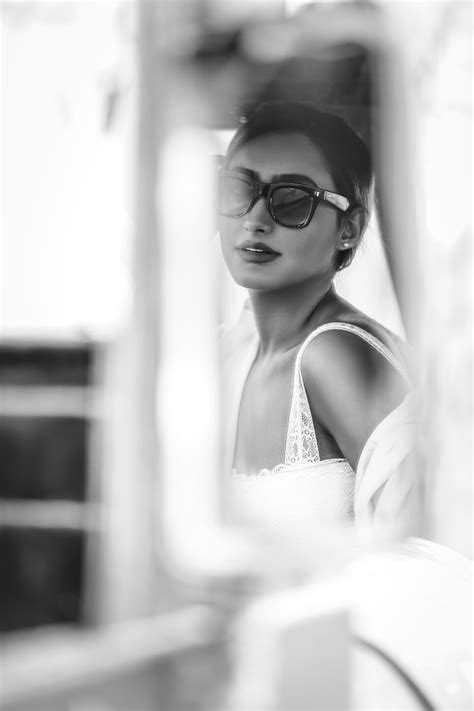 Woman In White Tank Top Wearing Black Sunglasses Photo Free Female Image On Unsplash