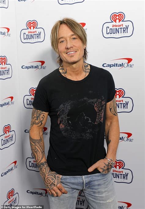 Keith Urban Shows Off His Bulging Biceps And Rockstar Tattoos In A