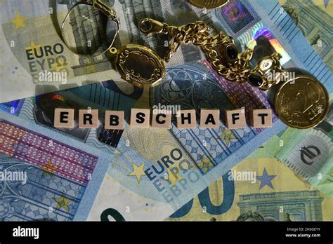 The German Word For Heritage With Wodden Cubes And Euro Bills Stock