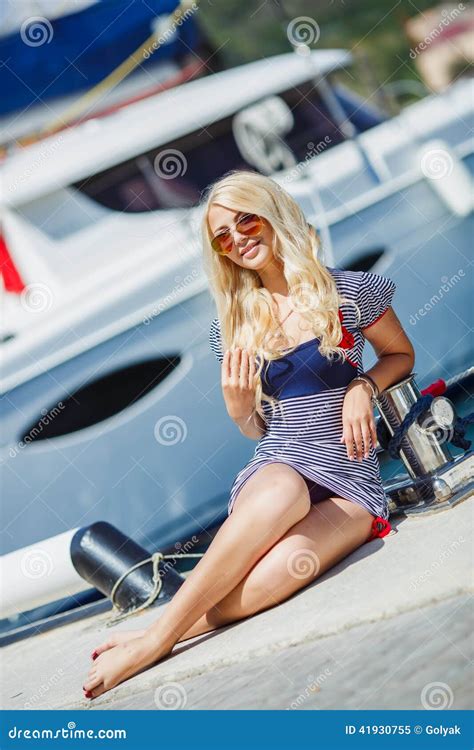 Beautiful Blonde In A Striped Dress Near Boats Stock Image Image Of