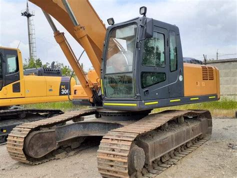 Купить бу Hyundai R290lc в Москве золотистый гусеничный экскаватор