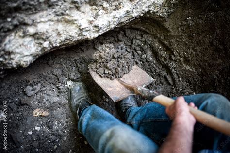 Man Digging A Hole In The Ground With Shovel And Spade Stock Photo Adobe Stock
