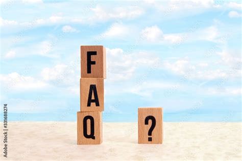 Faq Wooden Blocks And Questions Mark Word With Wooden Cube Block On Beach In Cloudscape
