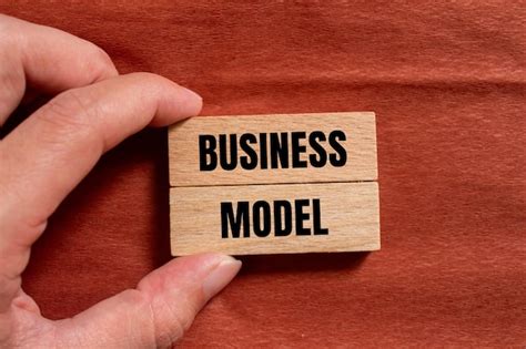 Premium Photo Business Model Message Written On Wooden Blocks With