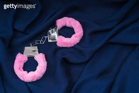 Sex Handcuffs With Pink Fur On Blue Silk Bedding Concept Role Playing Games 이미지 1287532547