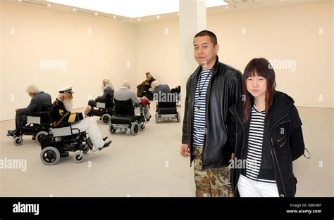 Artists Sun Yuan And Peng Yu Pose In Front Of Their Piece Old Persons Home In Charles Saatchi