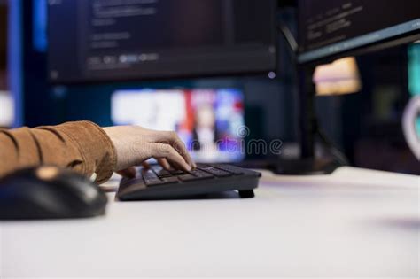 it remote worker at desk typing on keyboard installing safeguard code