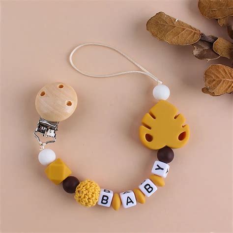 사용자 정의 편지 이름 나뭇잎 아기 젖꼭지 체인 아기 유아 씹는 가죽 끈 젖꼭지 홀더 Teether 장난감 선물에 대 한 Teether 펜 던 트조정 가죽끈 And 케이스