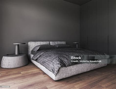 침대가 있는 어두운 침실 내부의 코너 전망 빈 회색 벽과 옷장 침대 옆 단단한 나무 바닥 미니멀리스트 디자인의 개념 3d 렌더링 고품질 3d 그림 0명에 대한 스톡 사진 및