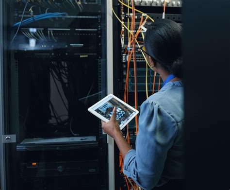 Premium Photo Server Room Engineer And Woman With A Tablet For Programming Cybersecurity Or