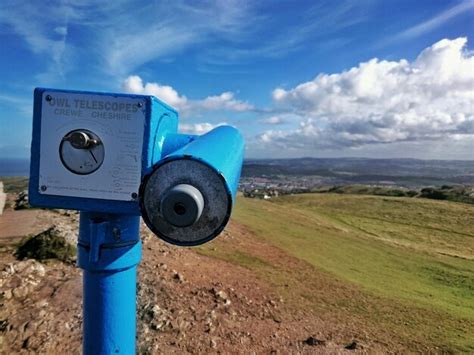 Premium Photo Telescope On Field Against Cloudy Sky