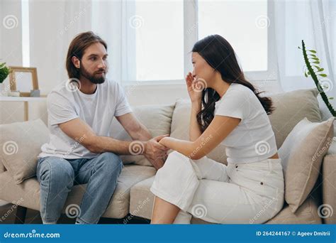 An Asian Woman Is Sad And Crying With Her Male Friend At Home Stress