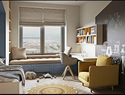 Уютная детская комната с окном местом письменным столом и книжной полкой