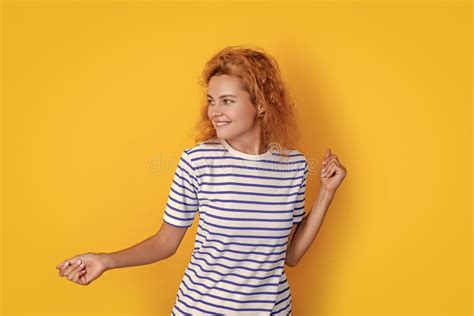 Positive Redhead Woman Having Fun Isolated On Yellow Background
