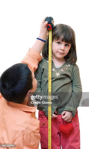 Brothers Measuring Height Photos And Premium High Res Pictures Getty