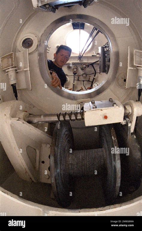 Machinery Repairman 2nd Class Diver Tim Ross Checks The Spool Inside The Submarine Rescue