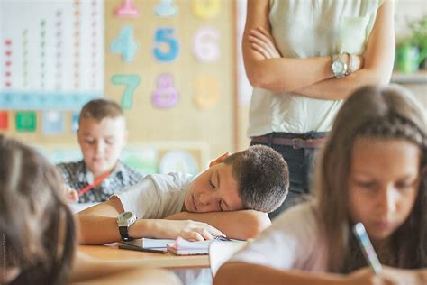 Boy Sleeping In Class By Stocksy Contributor Lumina Stocksy