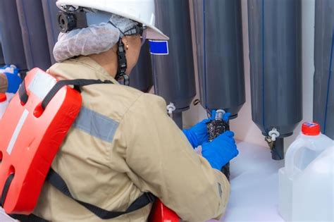 Premium Photo Chemists Researching With Marine Sampling Bottles On Vessel
