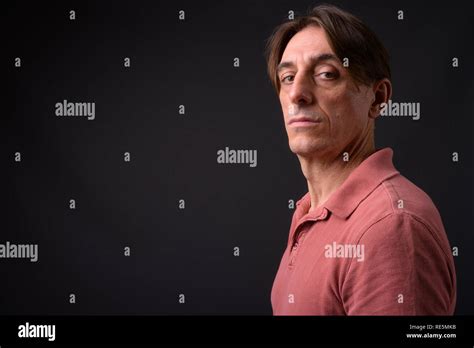 Mature Handsome Italian Man Against Gray Background Stock Photo Alamy
